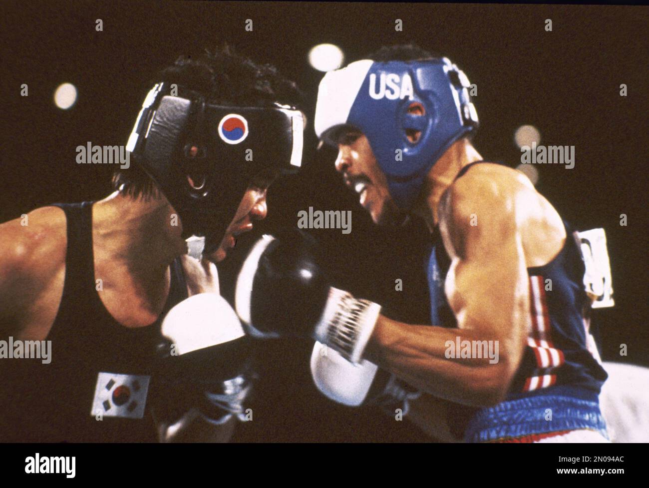 American boxer Jerry Page, right, throws a punch at Kim Dong-Kil of ...
