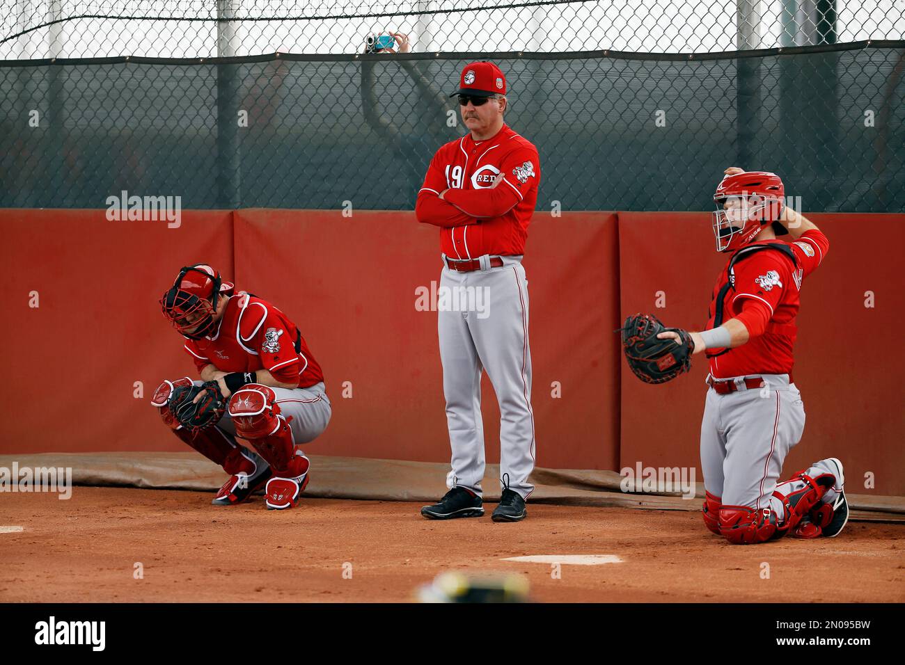 Cincinnati Reds pitching coach Mark Riggins watches during a spring ...