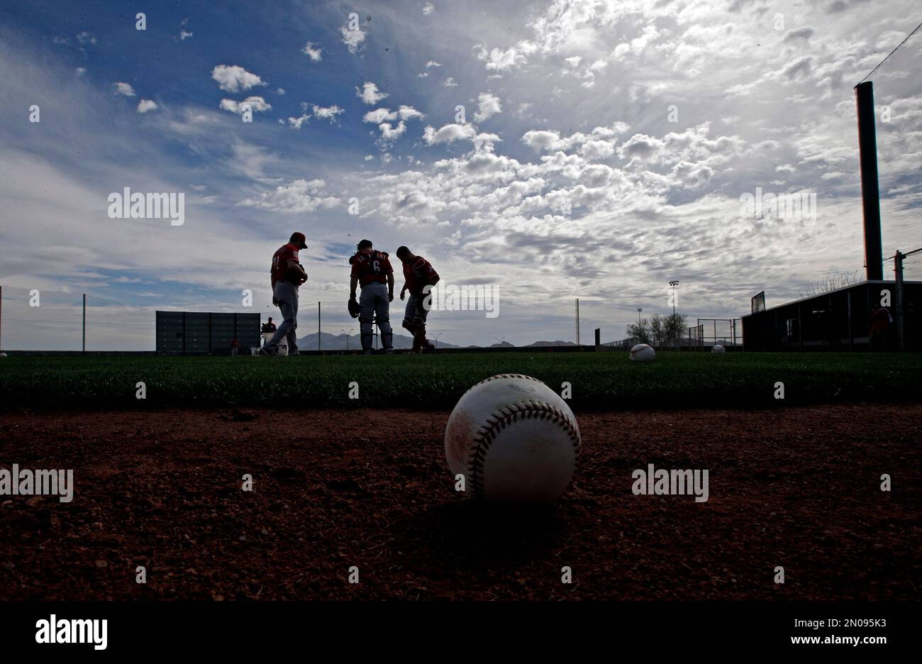 Cincinnati Reds players runs a drill during a spring training baseball ...