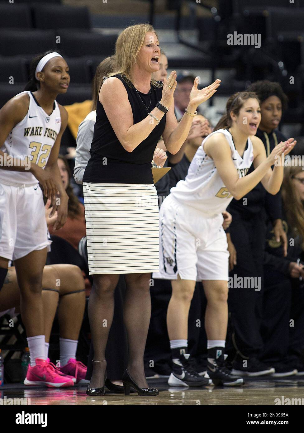 Wake Forest head coach Jen Hoover applauds her team's play first half ...