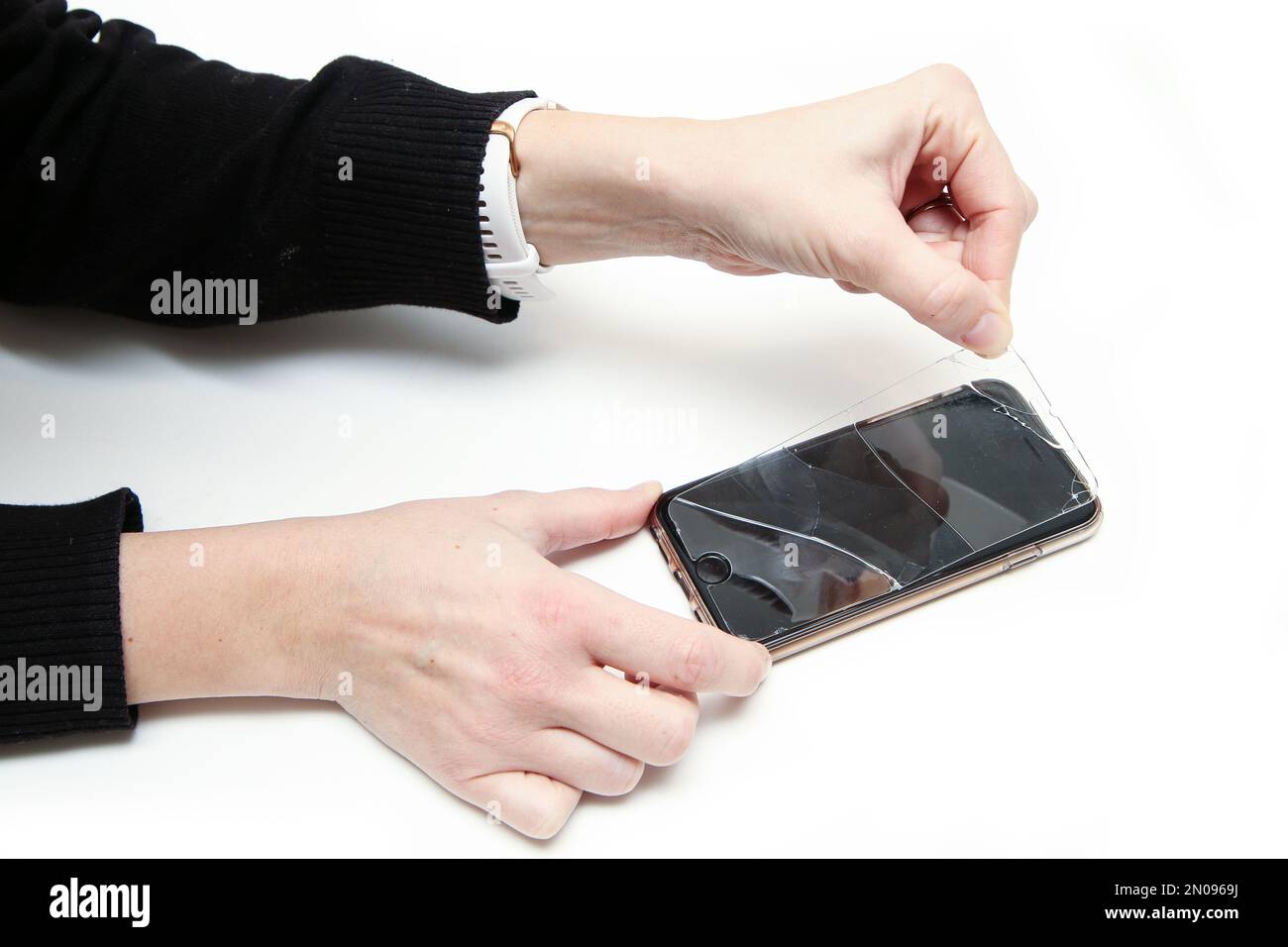 The detail of the hands removing the broken protection glass with ...