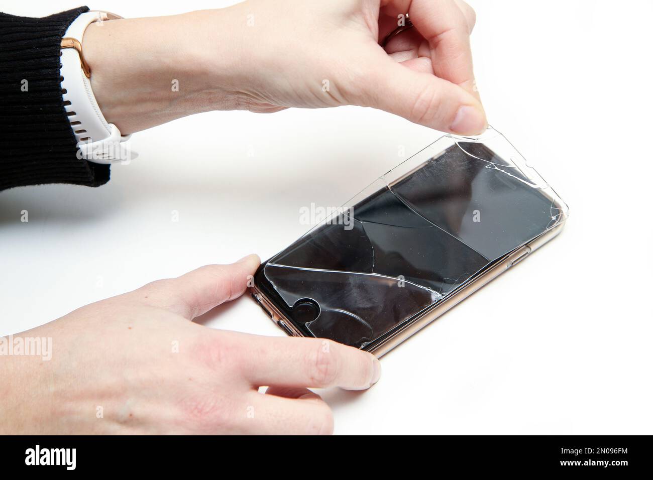 The detail of the hands removing the broken protection glass with ...