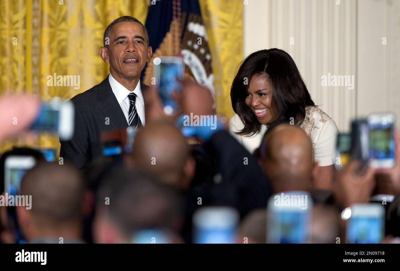 President Barack Obama and first lady Michelle Obama are seen above ...