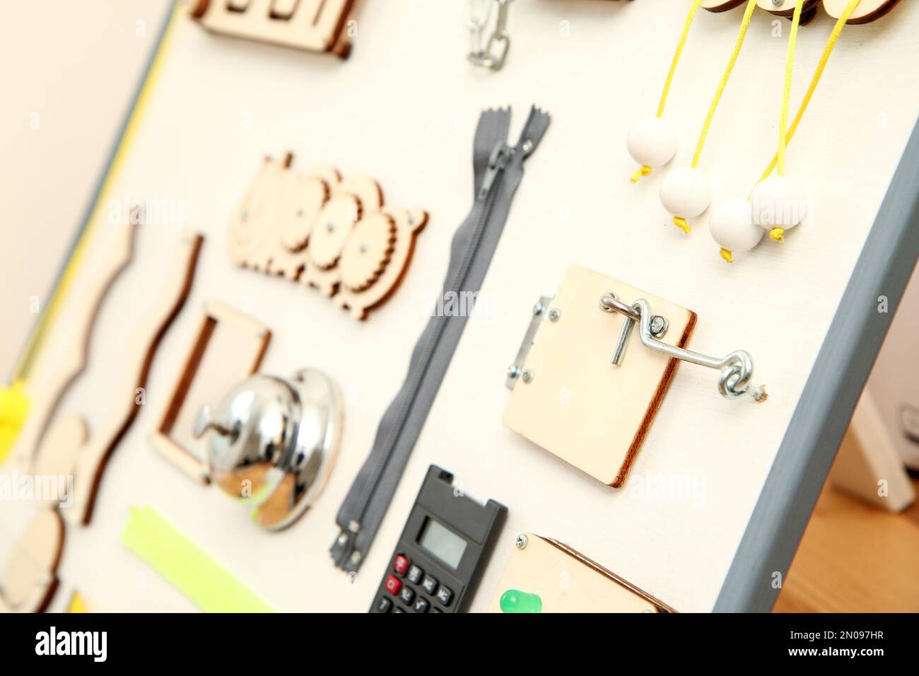 the home made activity board for the small children to play with and to ...