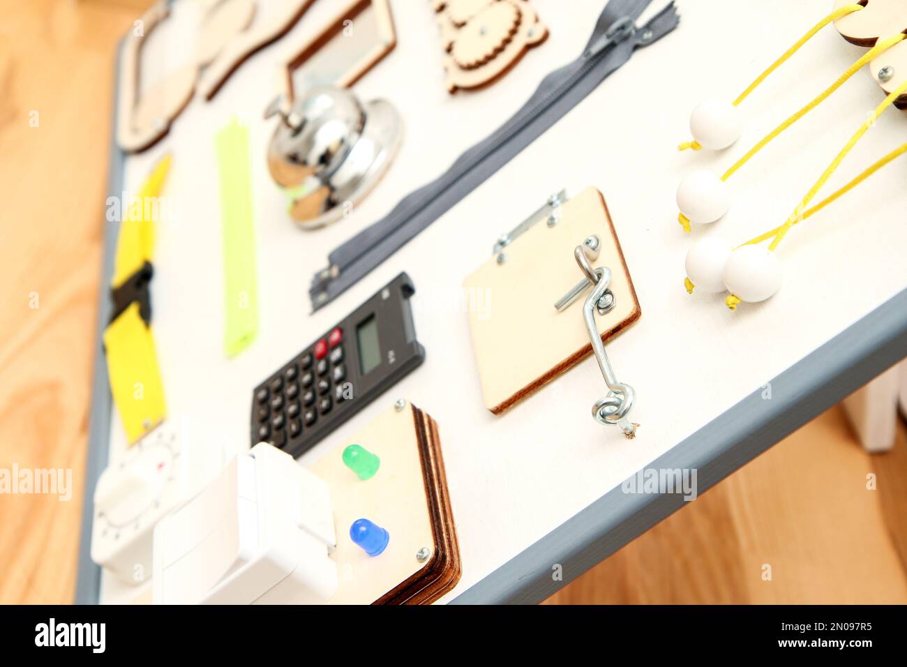 the home made activity board for the small children to play with and to ...