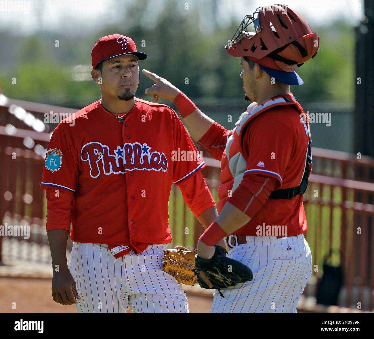 Philadelphia Phillies pitcher Ernesto Frieri, left, listens to catcher Jorge Alfaro after ...