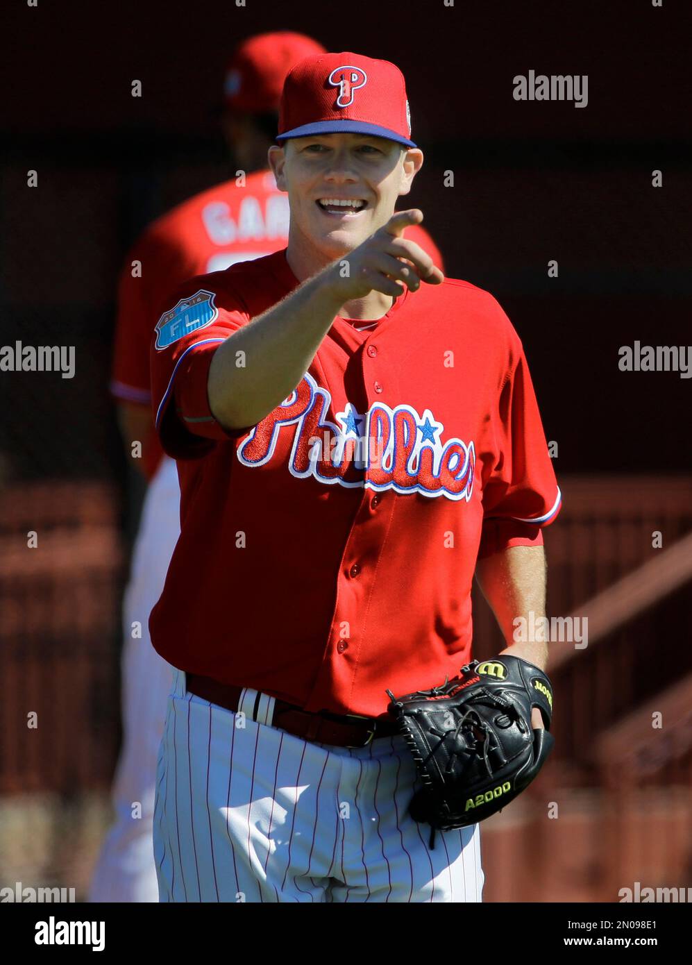 Philadelphia Phillies pitcher Andrew Bailey smiles and points at a ...