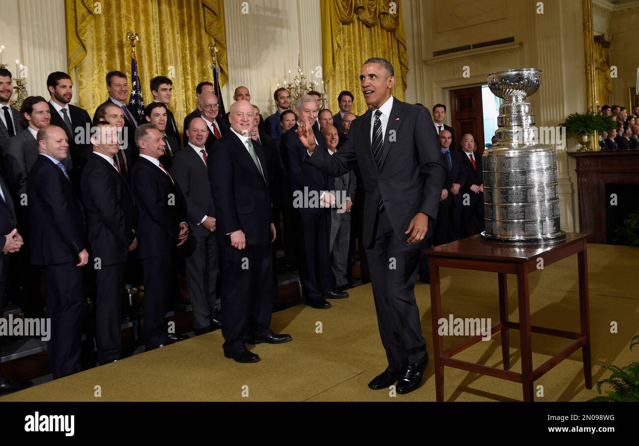 President Barack Obama walks past the Stanley Cup during a ceremony to ...