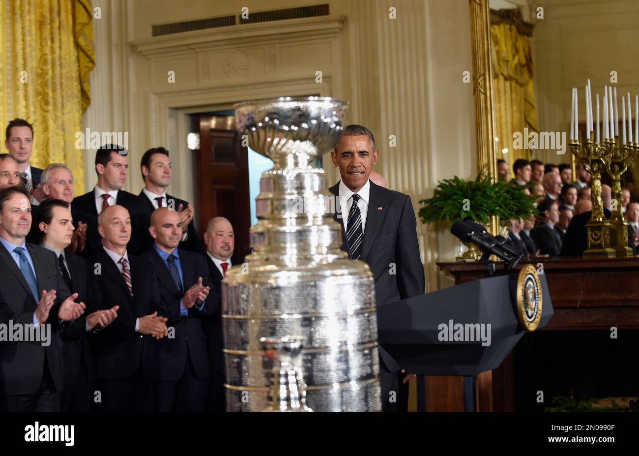 President Barack Obama looks at the Stanley Cup as he arrives to speak ...