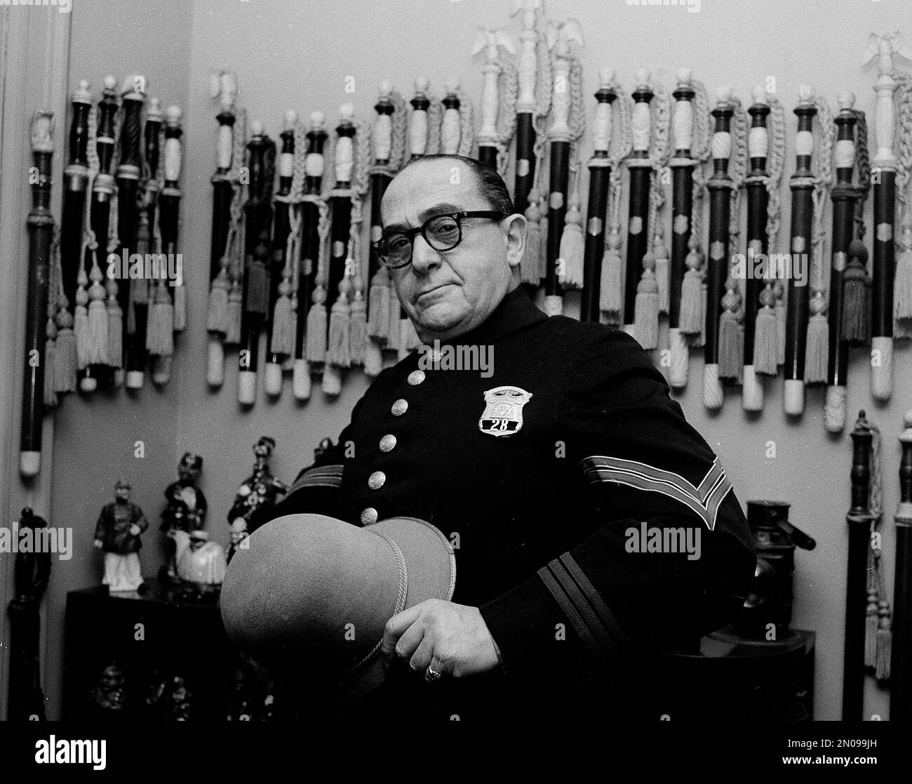 Holding hat, Jay Irving wears the uniform of a Roundsman of the New ...