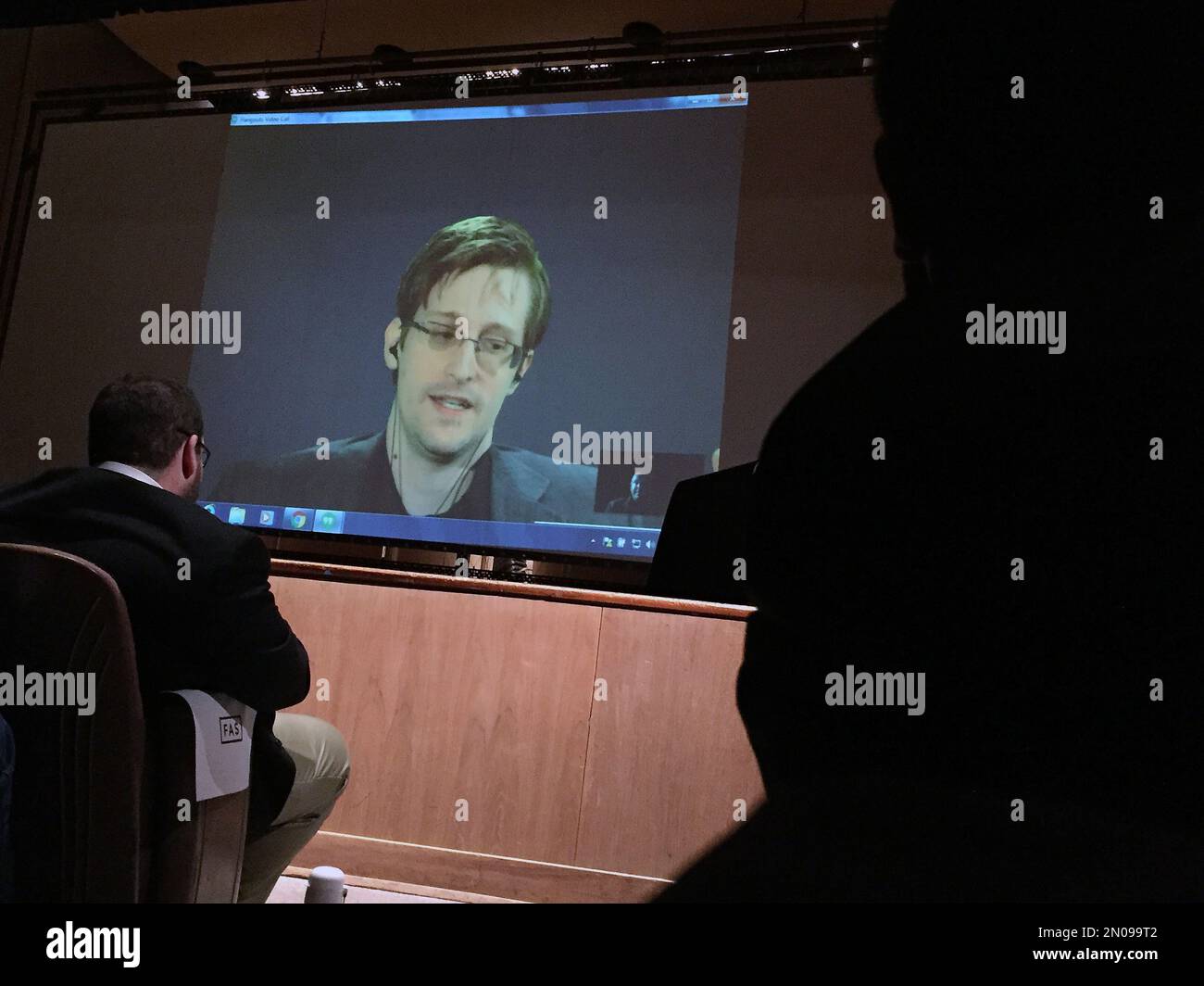 Former National Security Agency contractor Edward Snowden, center ...