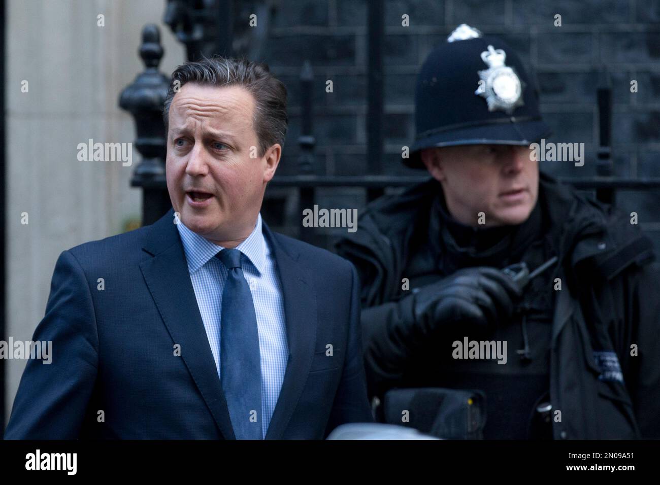 British Prime Minister David Cameron gets in the back of a car as he ...