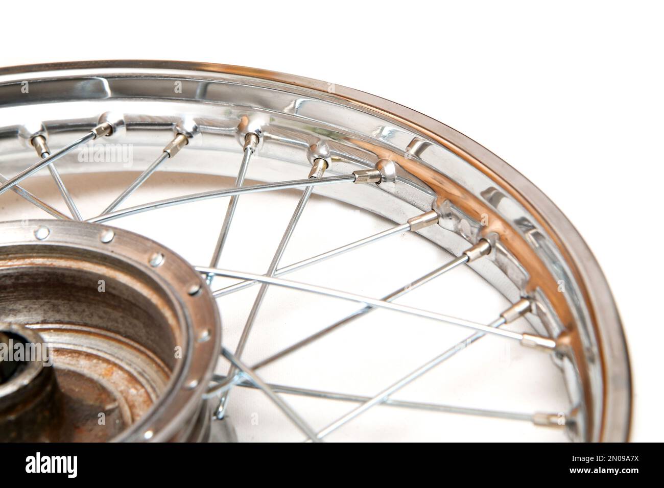 The shiny chrome rim from the old veteran motorbike with lacing ...