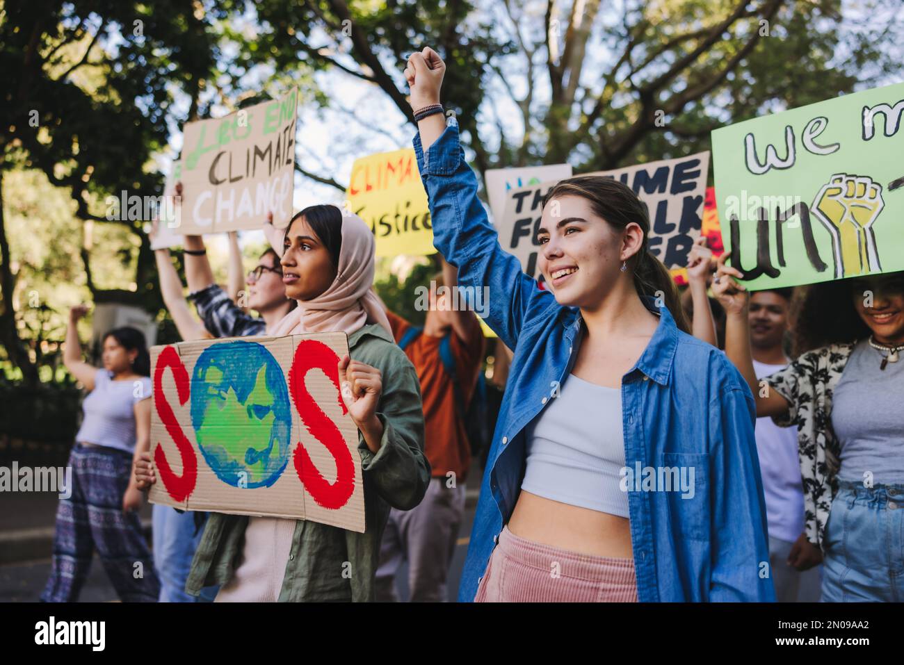 Generation z standing up against climate change. Group of multicultural ...