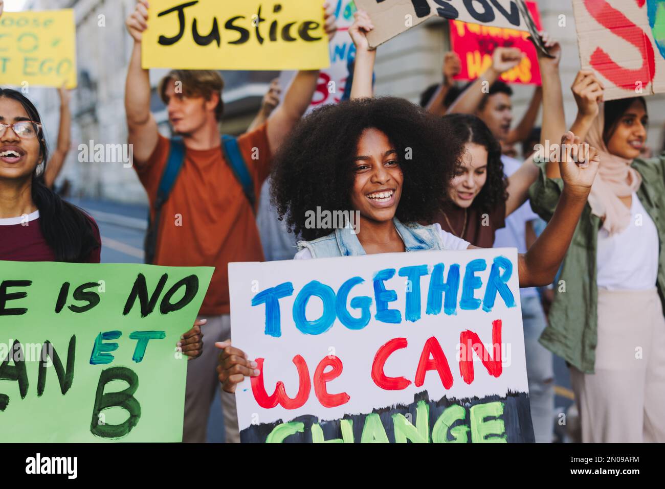 Activism for climate change. Group of multicultural youth activists ...