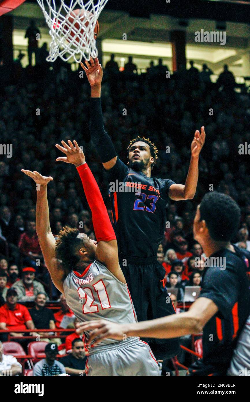 Boise State's James Webb III (23) shoots over New Mexico's Xavier Adams ...