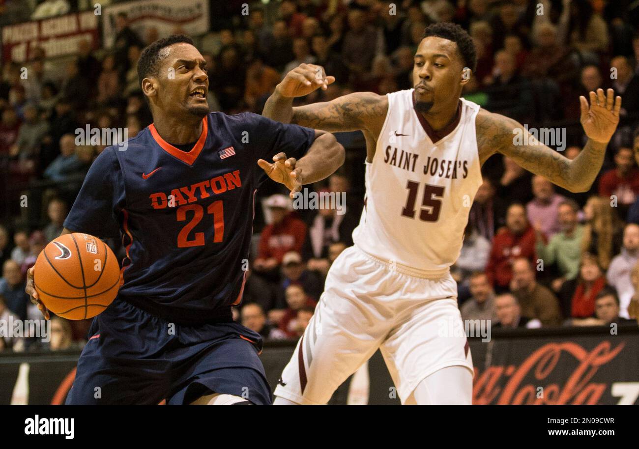 Dayton's Dyshawn Pierre (21) drives to the basket against Saint Joseph ...