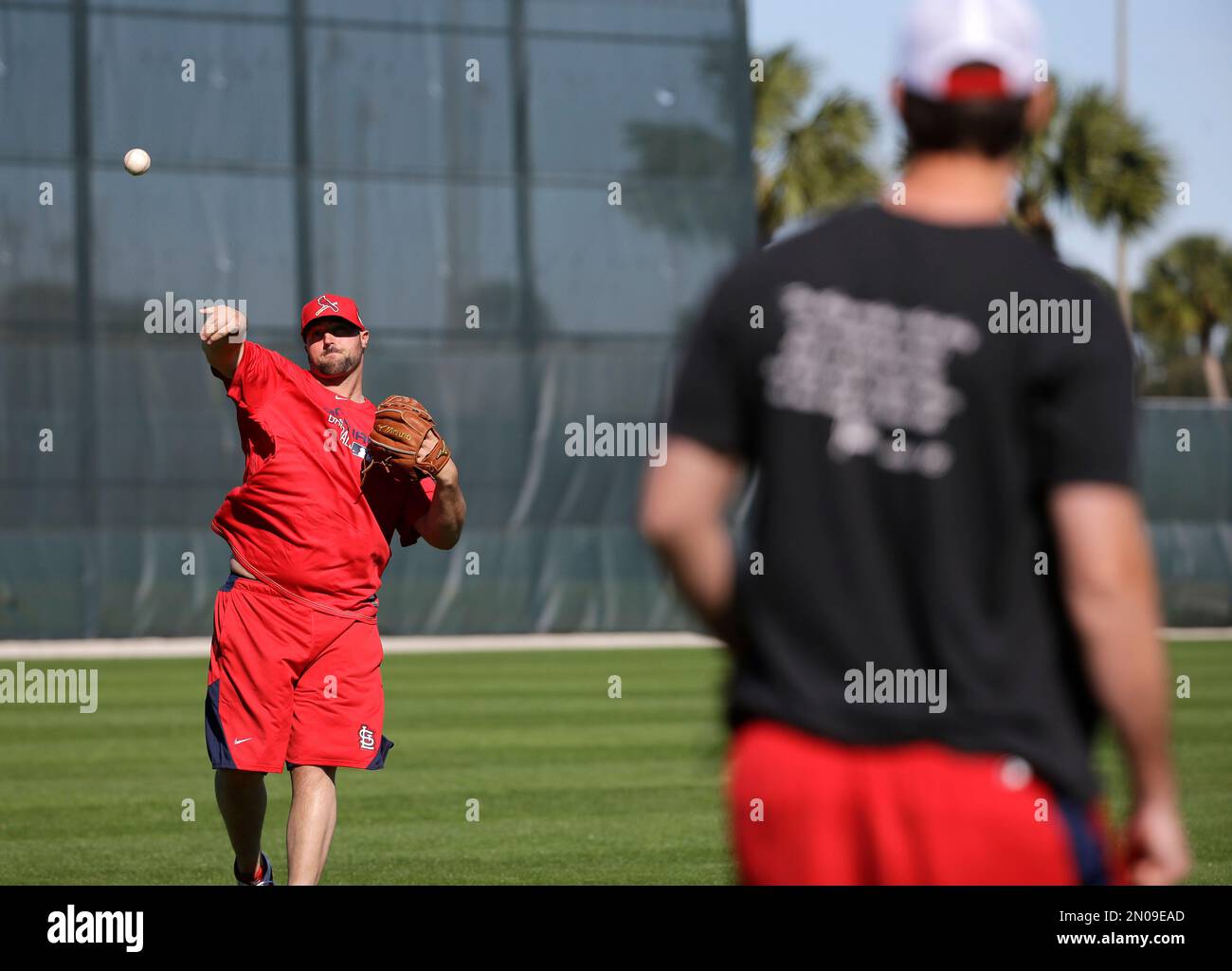 St. Louis Cardinals pitcher Jonathan Broxton, left plays catch with ...