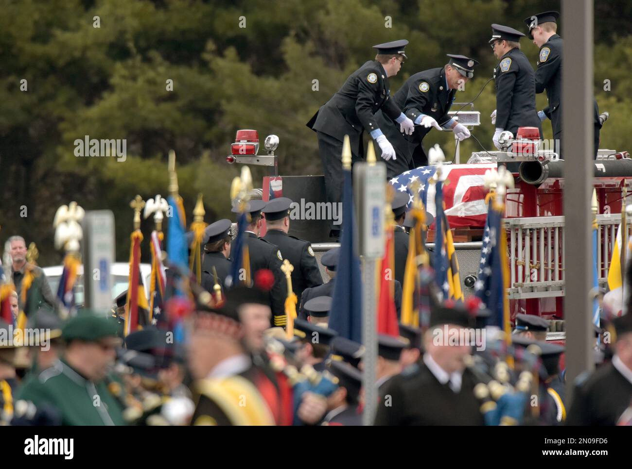 Members of the Joppa-Magnolia Volunteer Fire Company prepare to lift ...