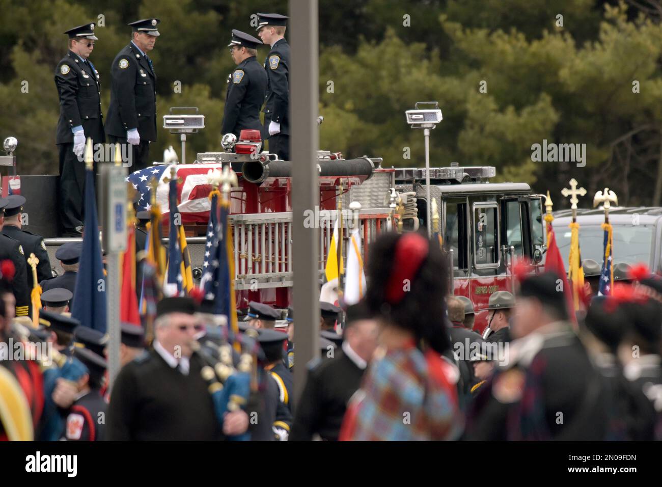 Members of the Joppa-Magnolia Volunteer Fire Company prepare to lift ...