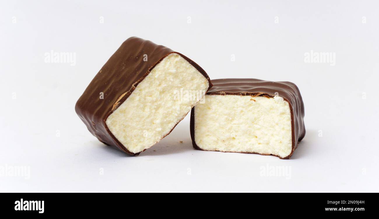 Chocolate Protein bar filled with chocolate sauce, on a white ...