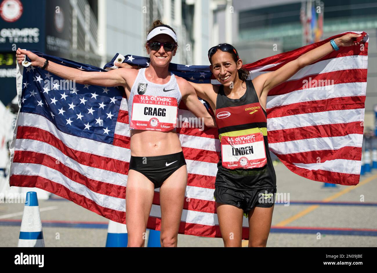 Amy Cragg, left, and Desiree Linden, right, pose at the finish line ...