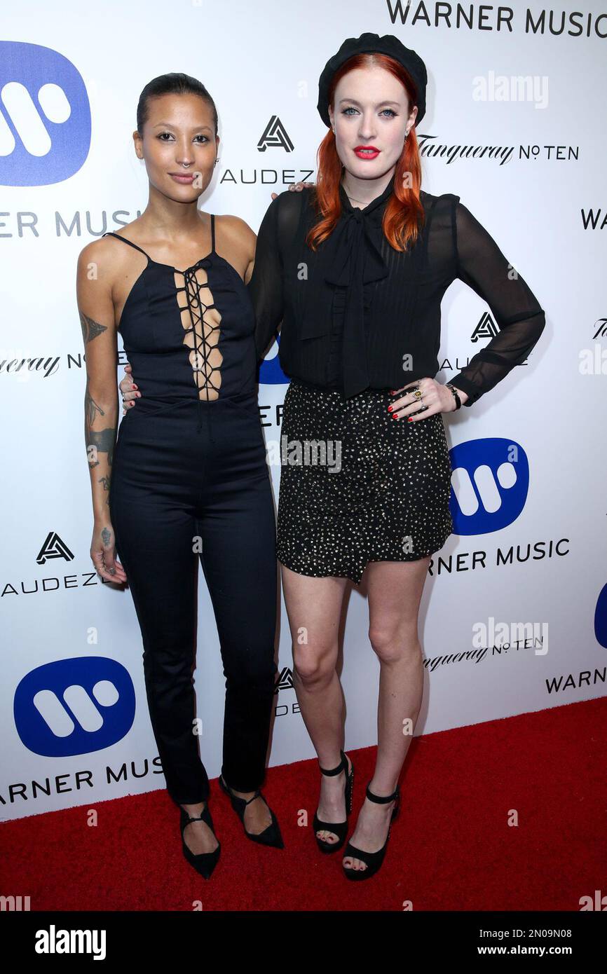 Aino Jawo, left, and Caroline Hjelt of Icona Pop arrive at the Warner ...