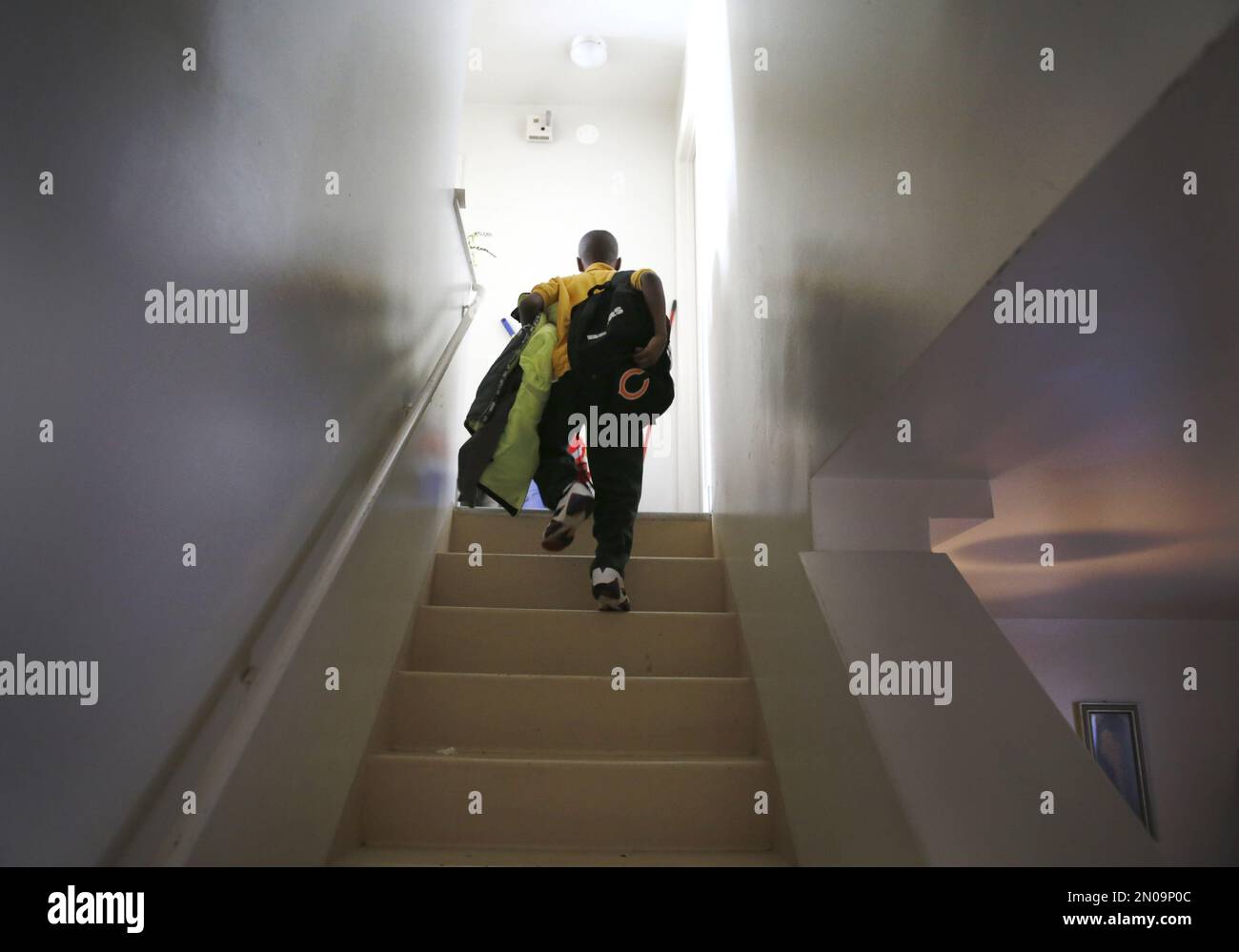 In this Jan. 29, 2016, photo, Mario Hendricks heads up the stairs of ...