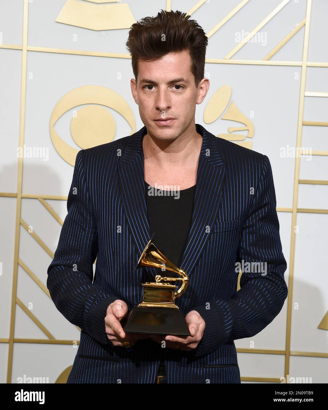 Mark Ronson poses in the press room with the award for best pop duo ...