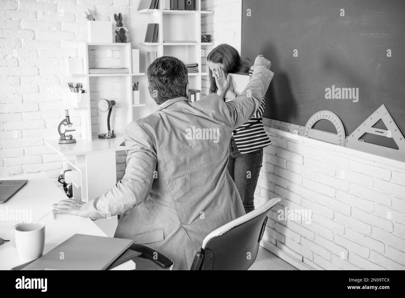 angry teacher shouting at child at blackboard Stock Photo - Alamy
