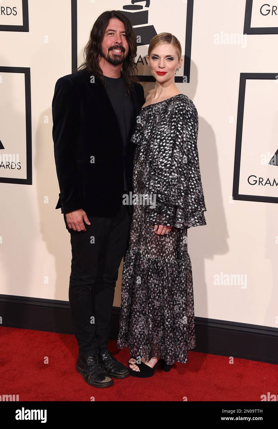 Dave Grohl, left, and Jordyn Blum arrive at the 58th annual Grammy ...