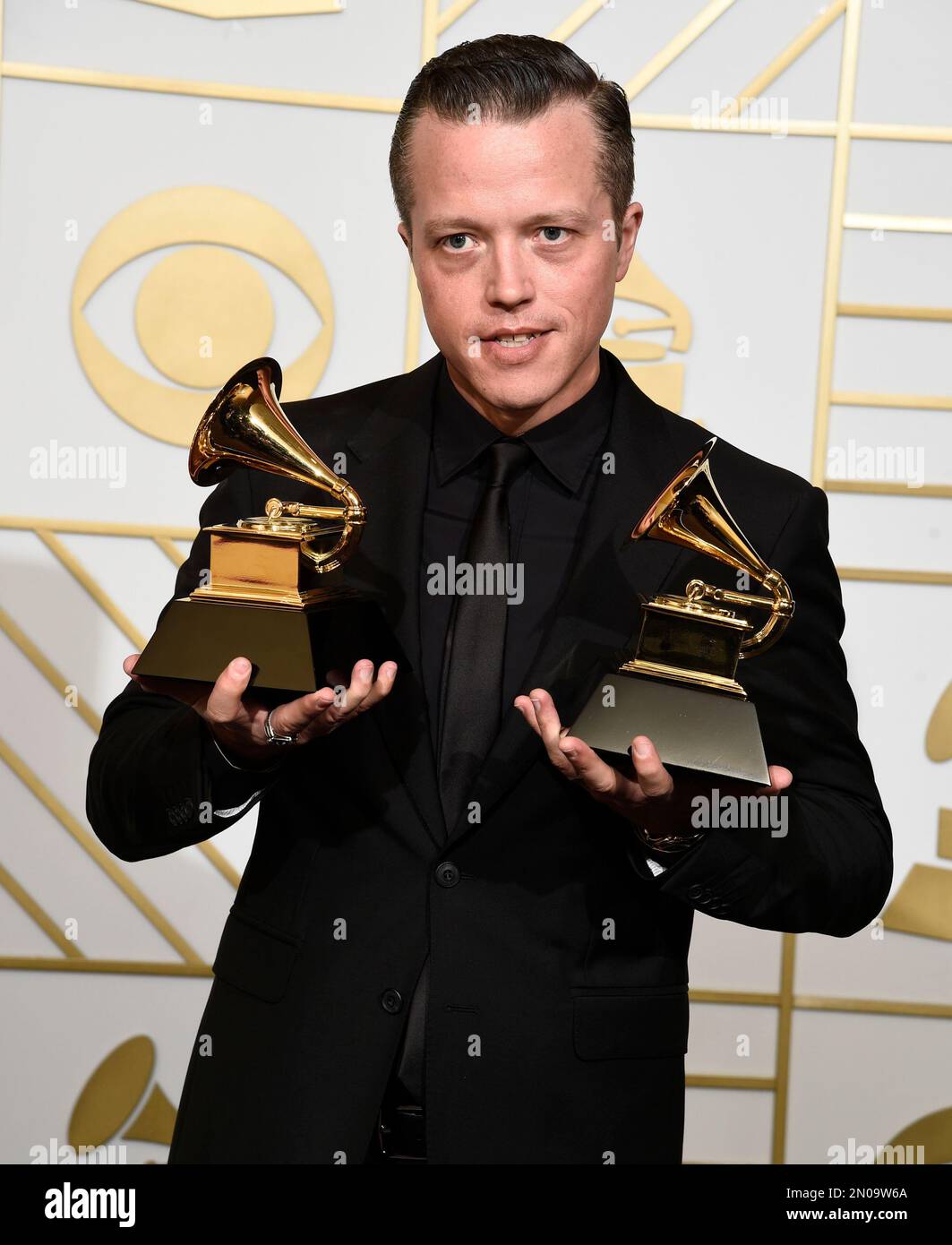 Jason Isbell poses in the press room with the awards for best americana ...