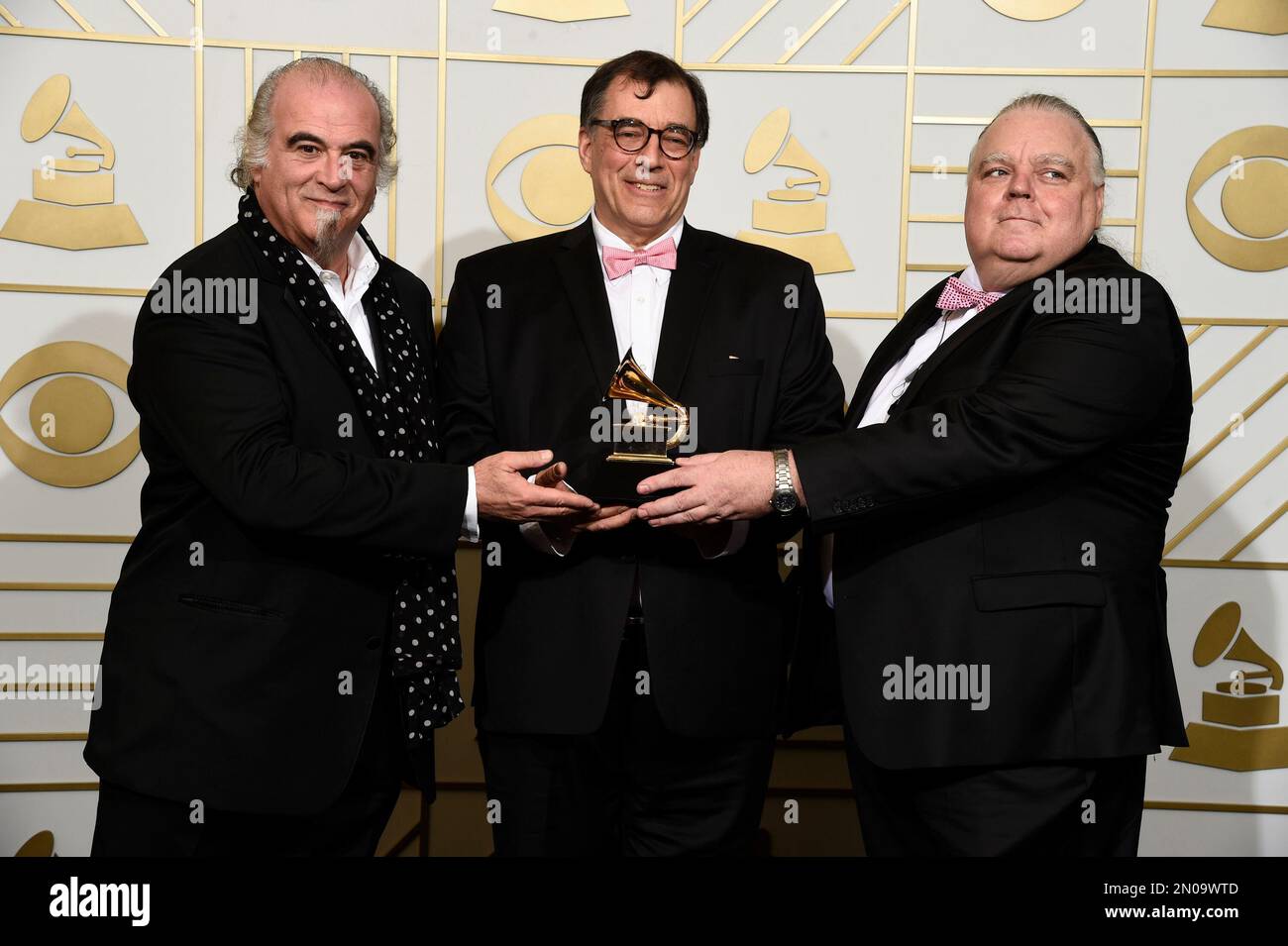 Steve Berkowitz, from left, Jan Haust, and Peter J. Moore pose in the ...