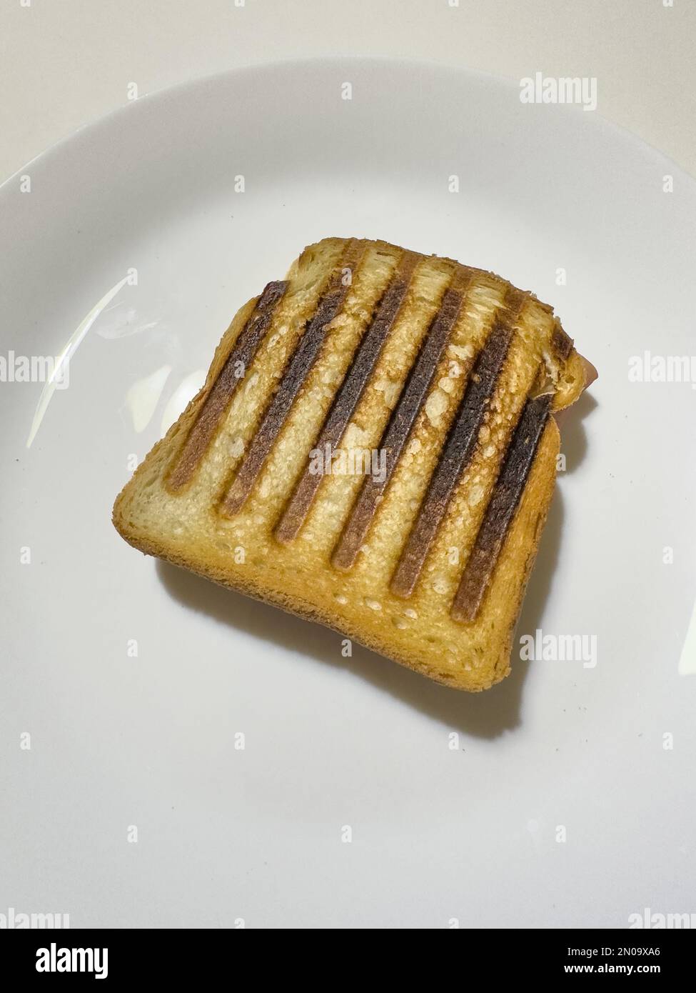 Italian Toast, with fresh ham and cheese, homemade on white plate ...