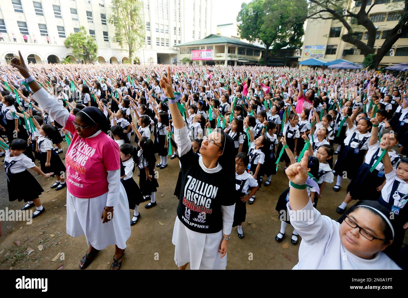 Students and nuns of the Catholic-run St. Scholastica's College flash ...