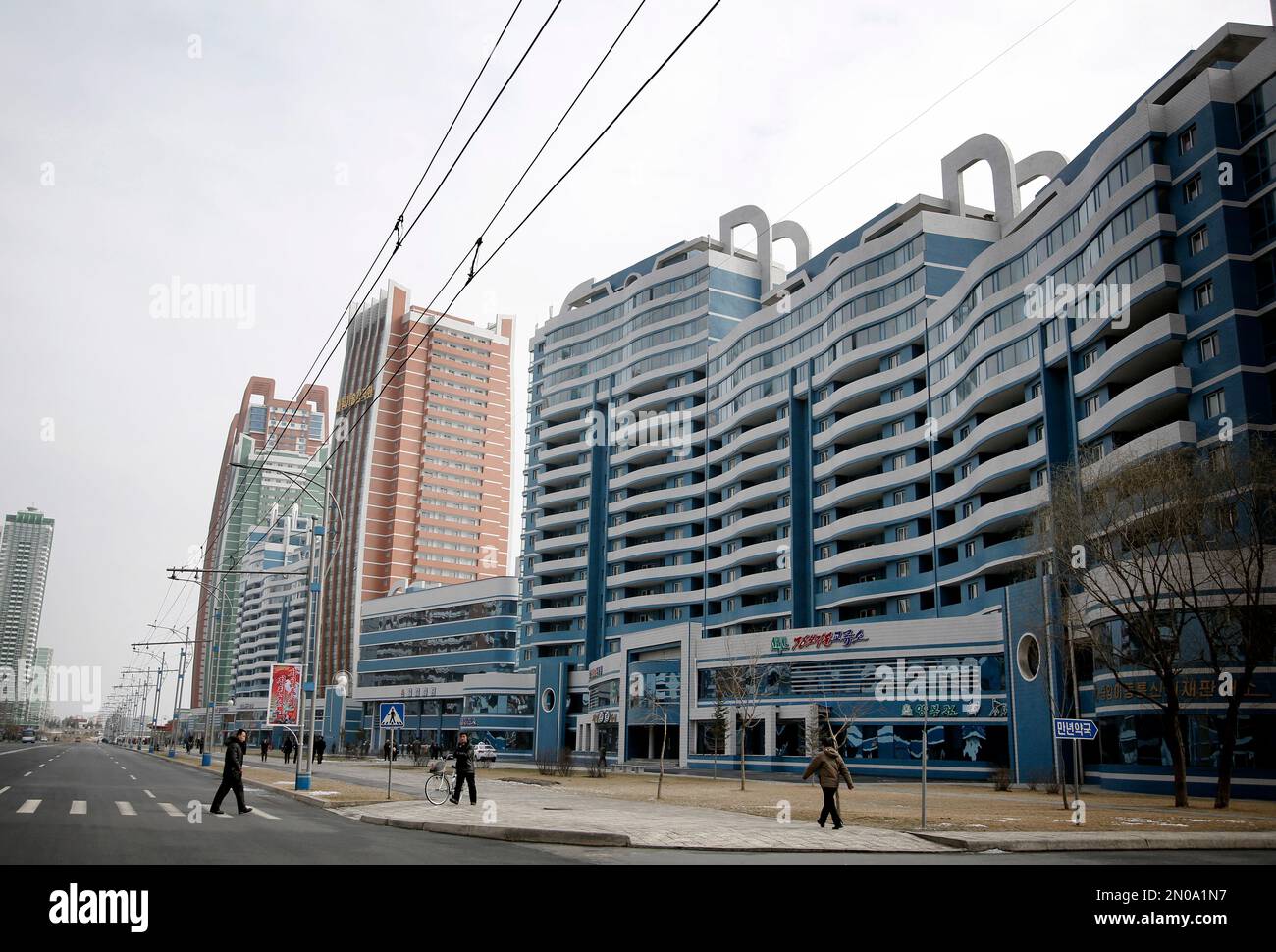 North Koreans cross a road at the Mirae Scientists street, Pyongyang's ...