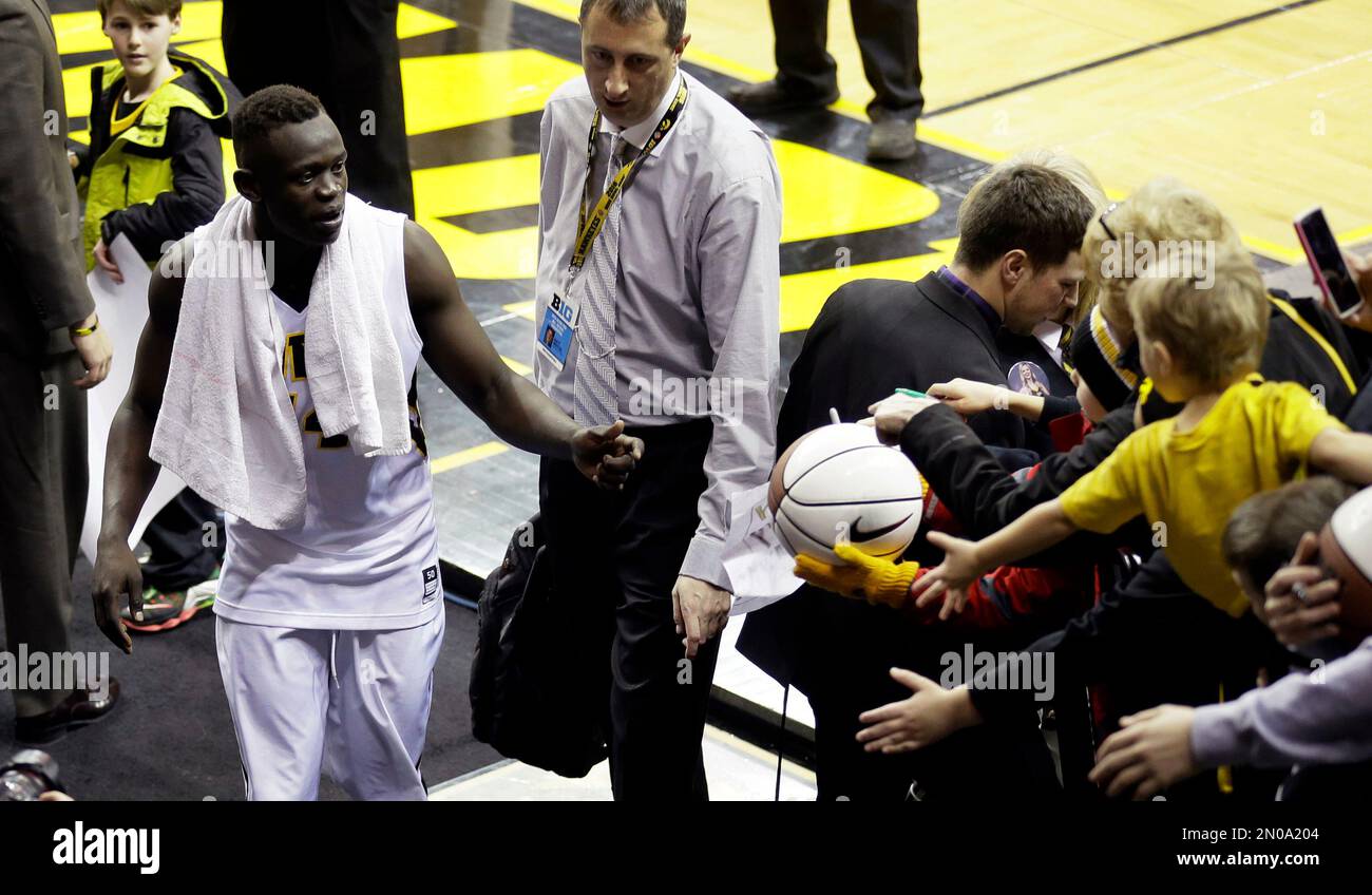 Iowa guard Peter Jok reacts with fans after an NCAA college basketball ...