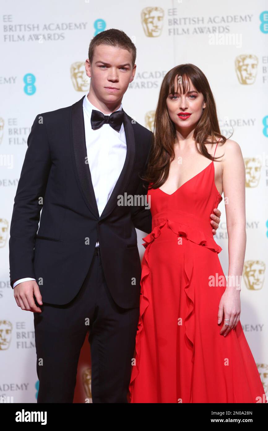 Will Poulter and Dakota Johnson pose for photographers backstage at the ...