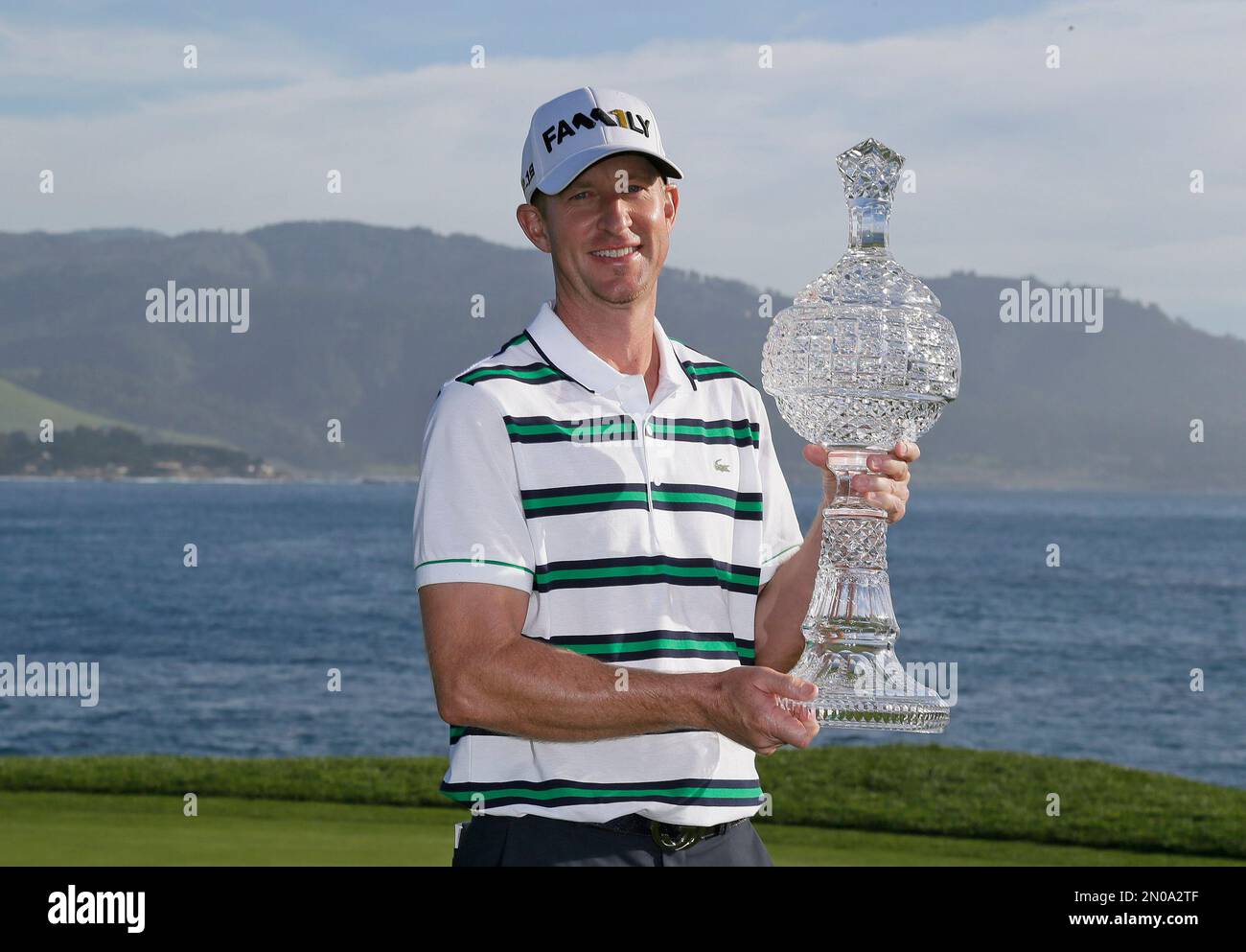 Vaughn Taylor poses with his trophy on the 18th green of the Pebble ...