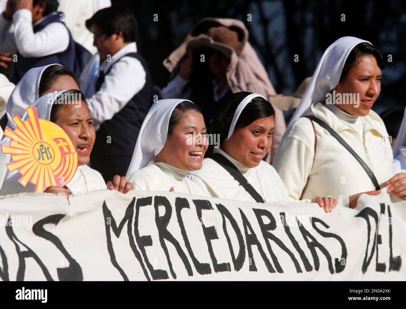Nuns holds a banner that identify their order, as they wait for Pope ...