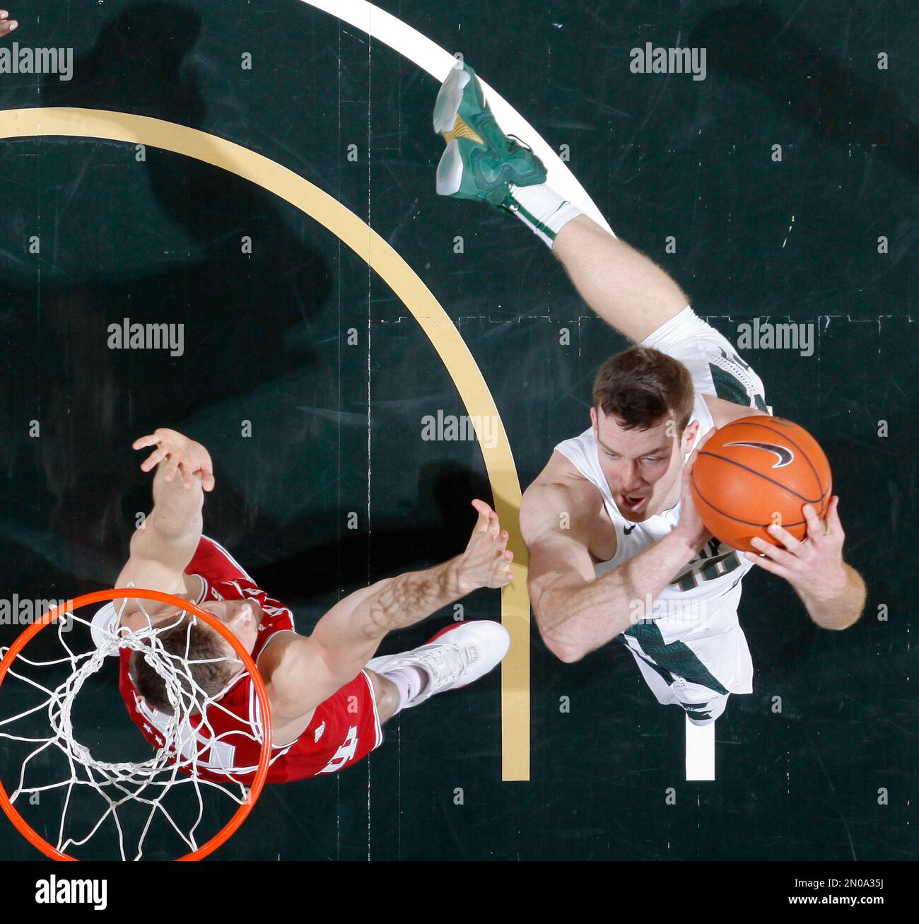 Michigan State's Matt Costello, right, shoots against Indiana's Collin ...