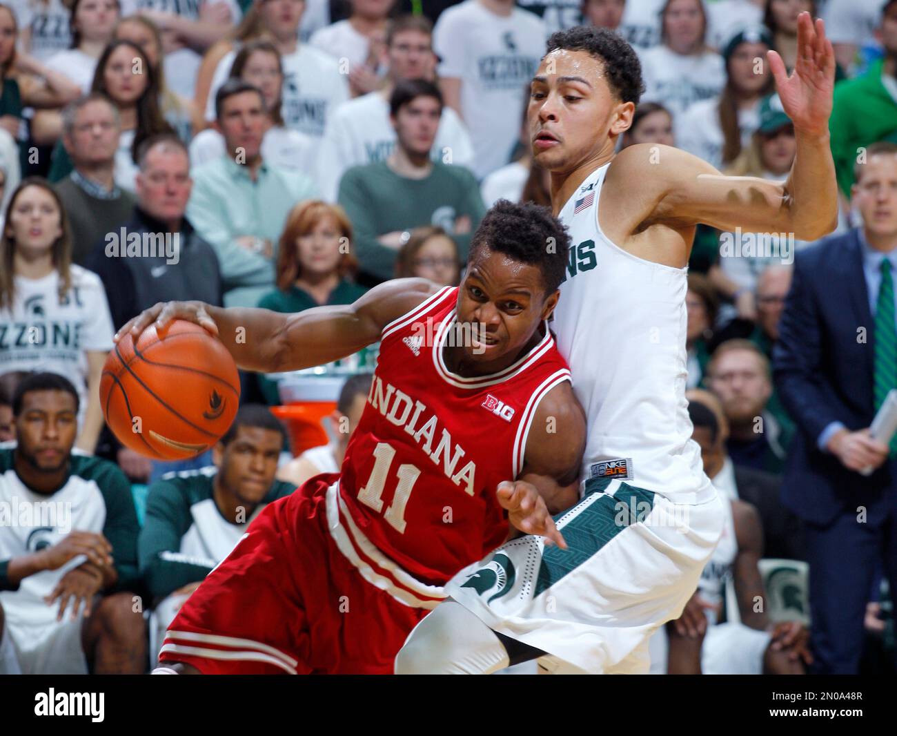 Indiana's Kevin Yogi Ferrell (11) drives against Michigan State's Bryn ...