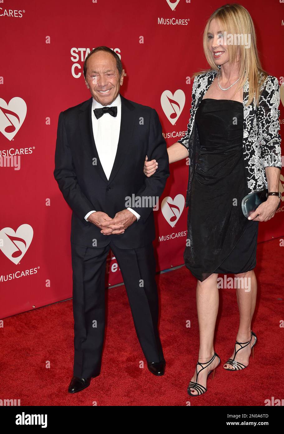Paul Anka, left, and and Lisa Pemberton arrive at the MusiCares Person ...