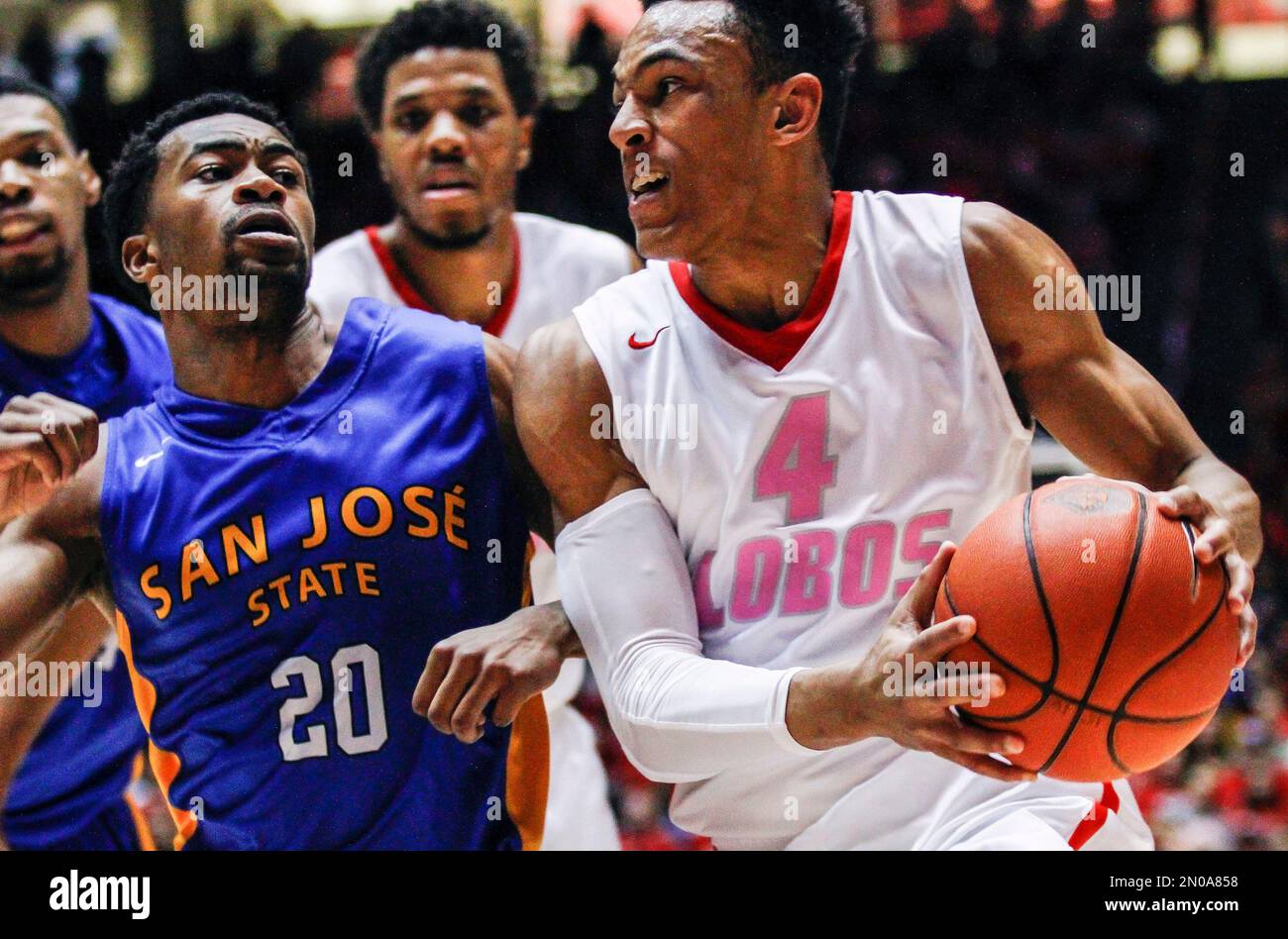 New Mexico's Elijah Brown (4) drives the baseline while guarded by San ...