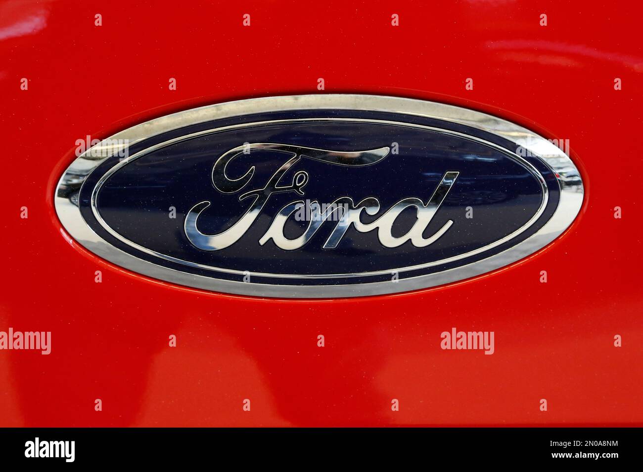 This is the Ford logo on the grill of a 2016 Ford F150 truck on display ...