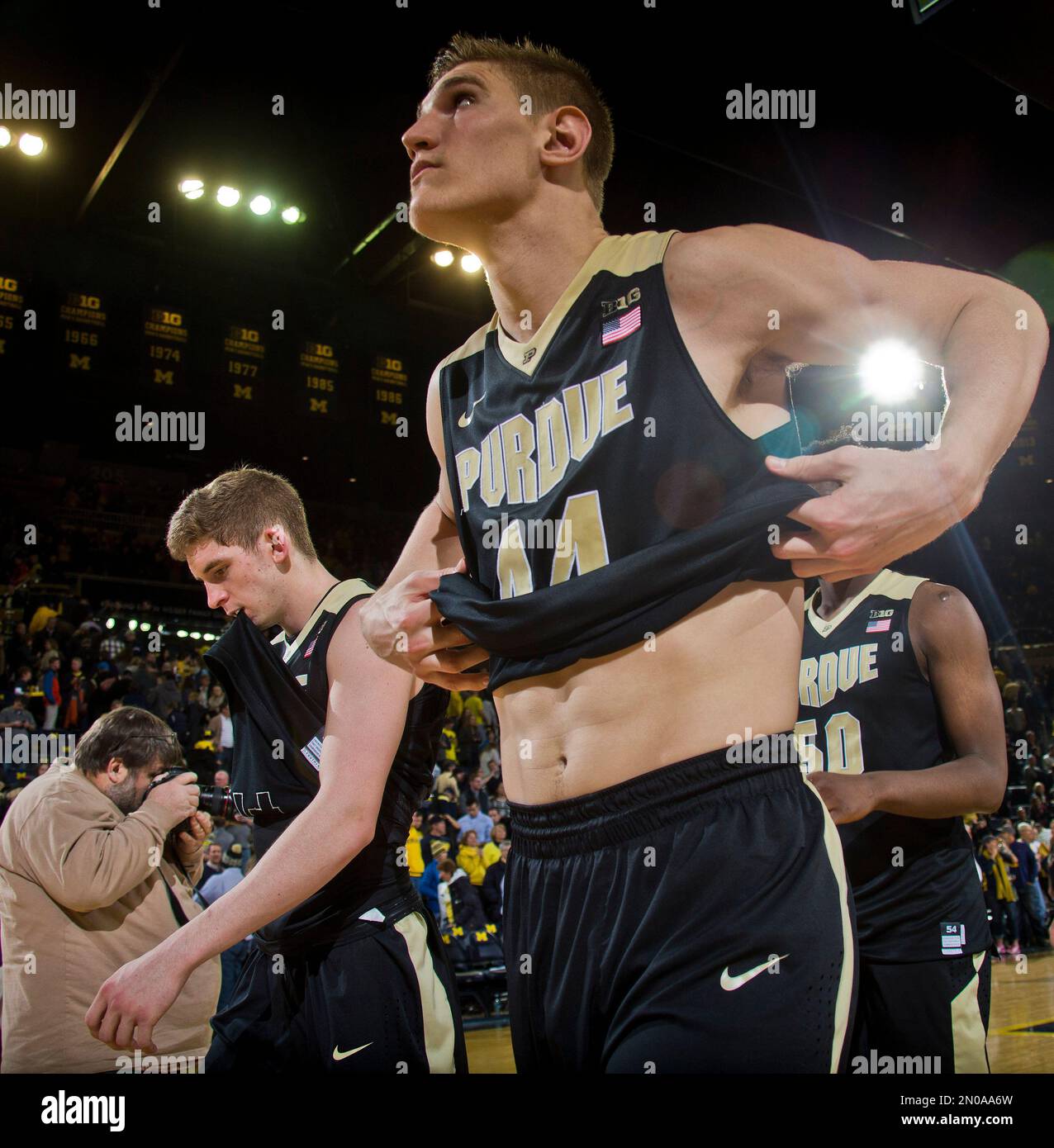 Purdue guard Ryan Cline, left, and center Isaac Haas (44) walk off the ...