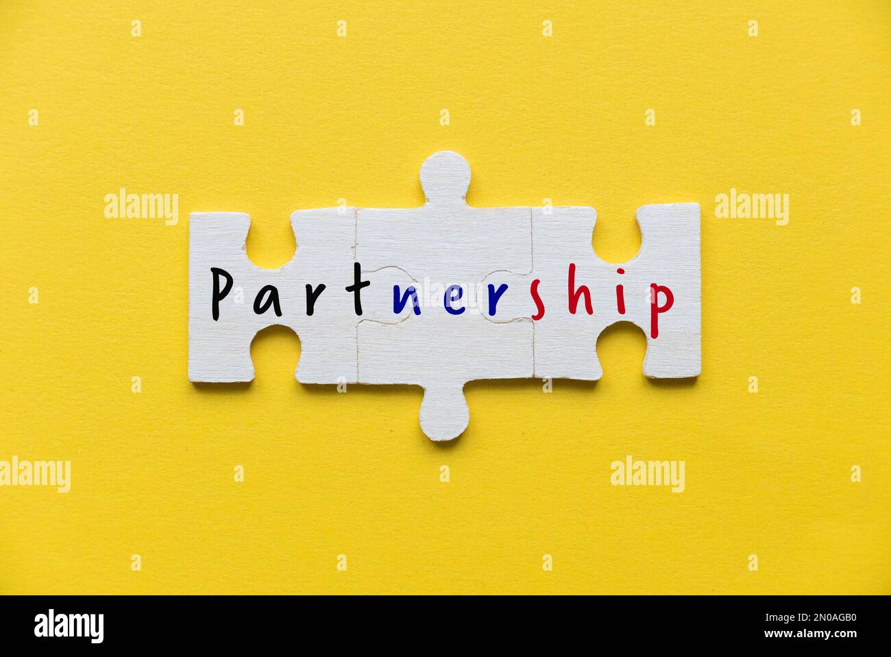 Top view of three puzzle pieces with word partnership Stock Photo - Alamy