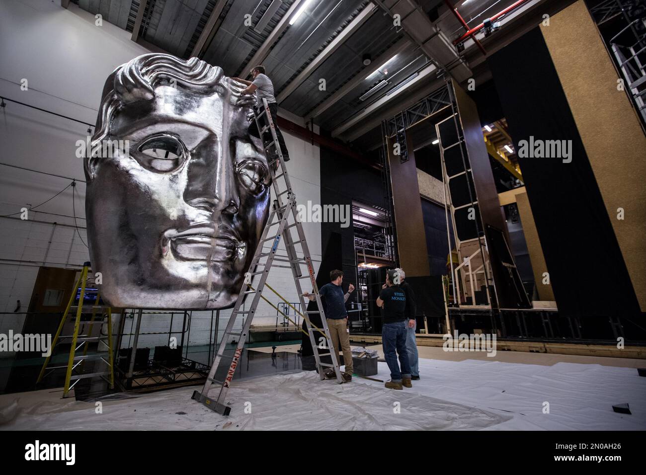 Set builders work on a giant replica of the British Academy Films ...