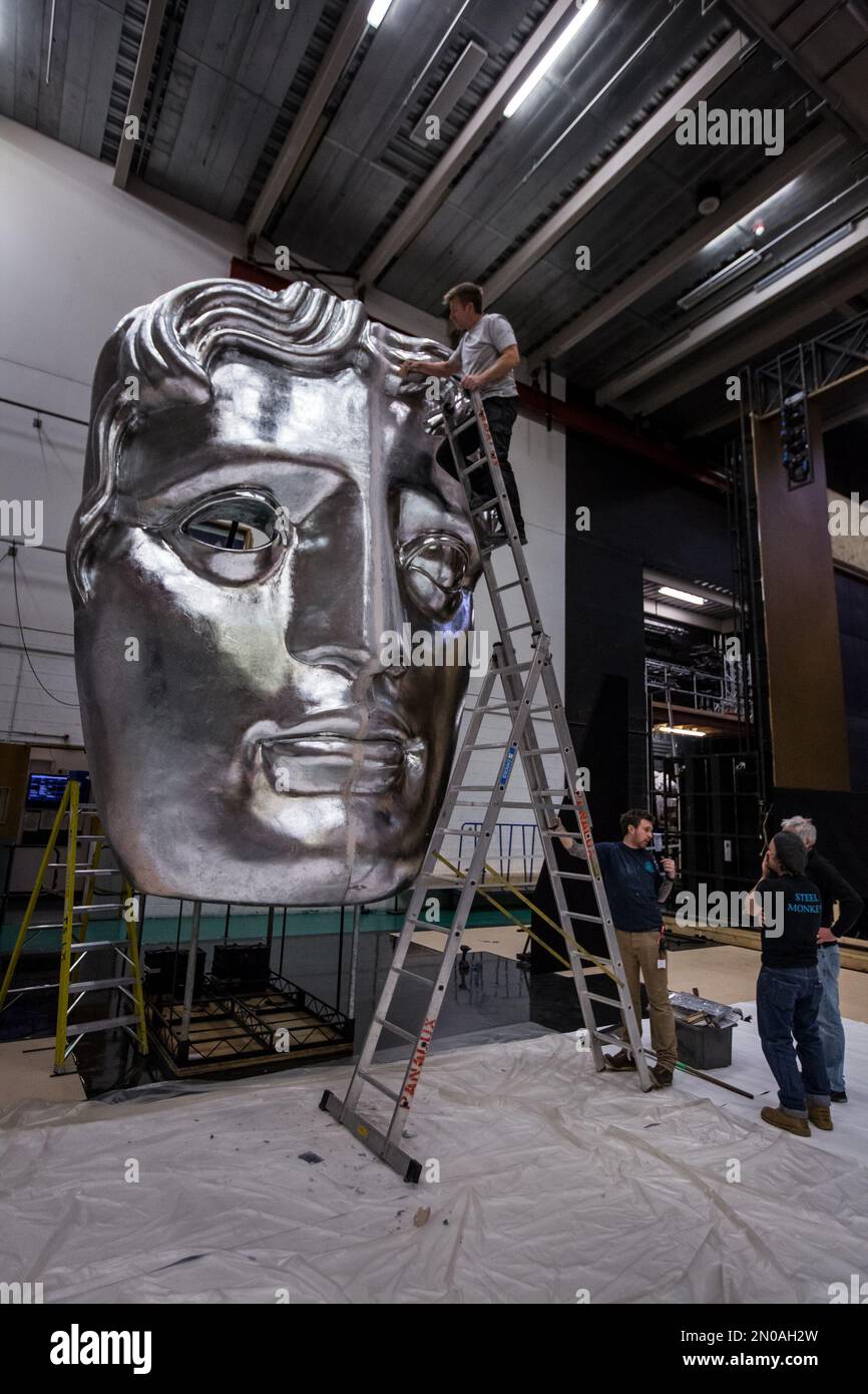 Set builders work on a giant replica of the British Academy Films ...