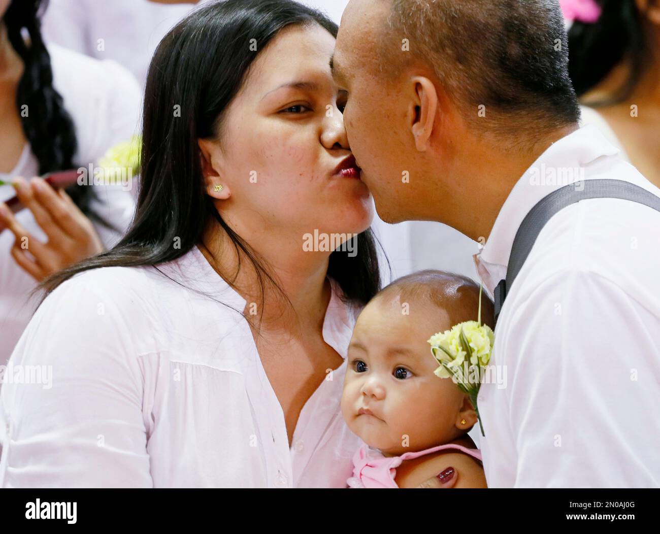 Filipino couple Woody and Cristy Bautista, cuddle their daughter five ...